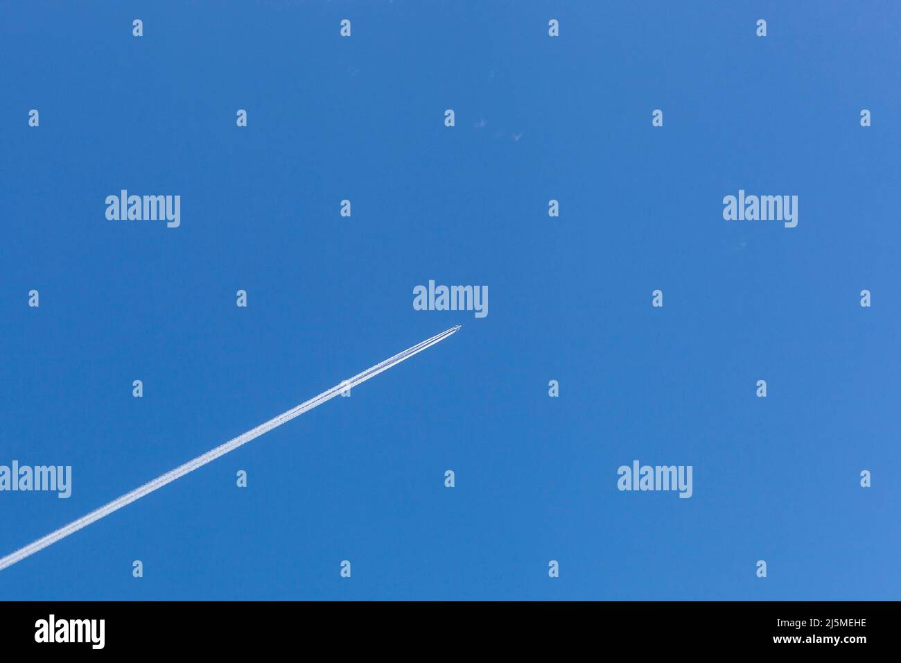 airplane moving over the blue sky background Stock Photo - Alamy