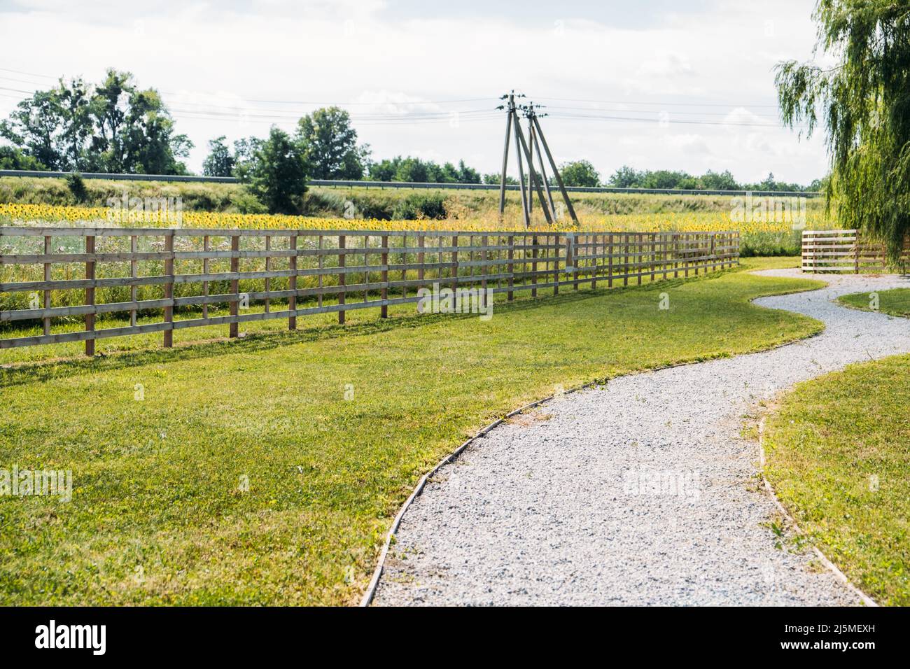 Beautiful day on the farm. Countryside landscape, rural farm and wooden ...
