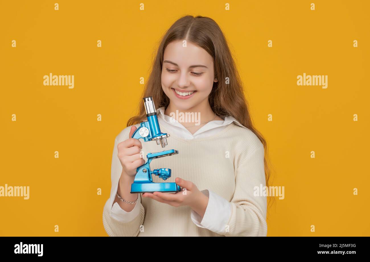 positive child with microscope on yellow background Stock Photo - Alamy