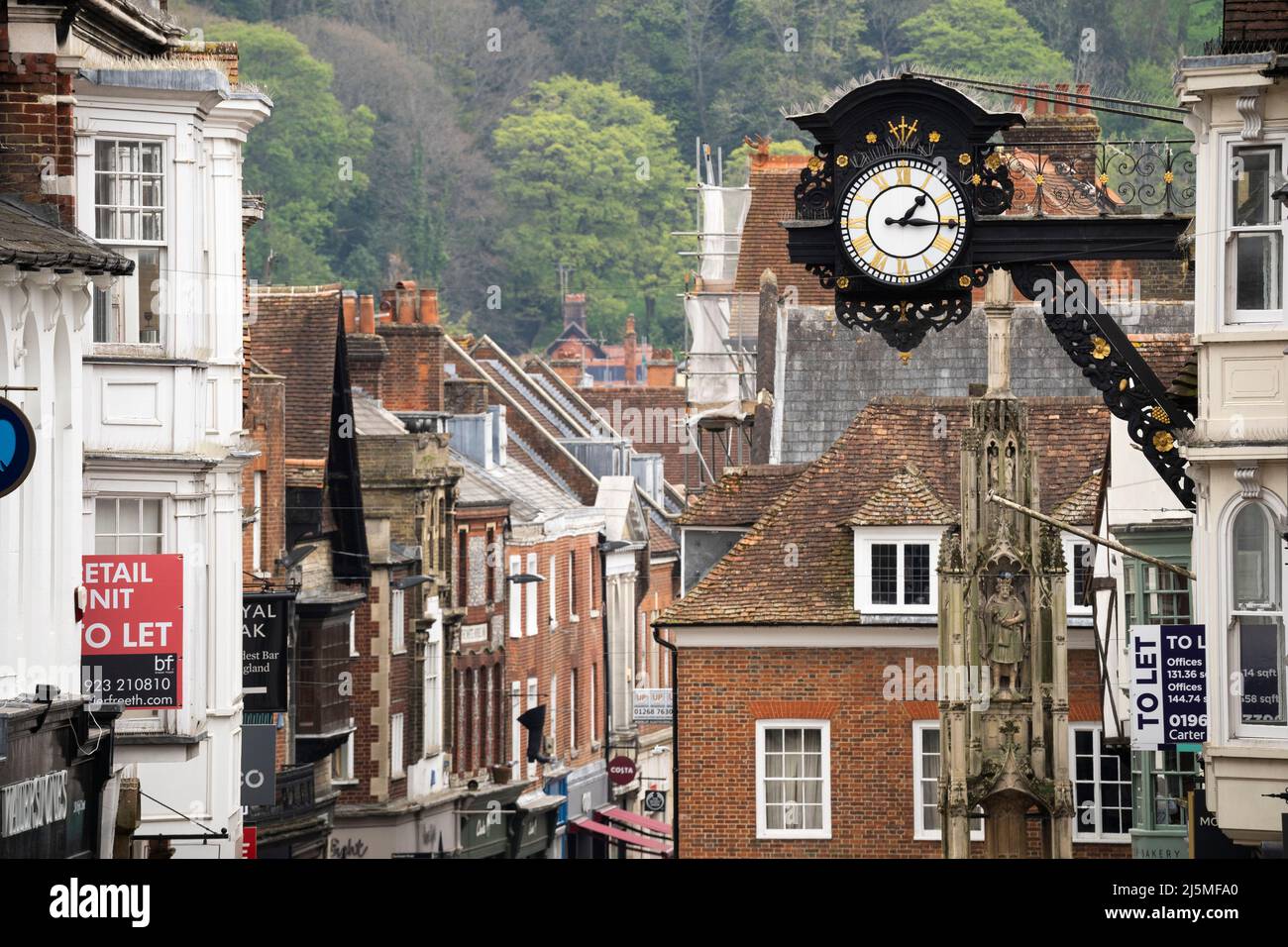 The historical Victorian hanging clock on Winchester High Street with ...