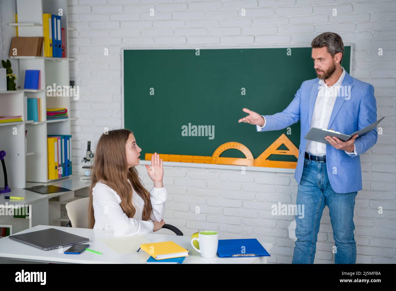 kid study in classroom with teacher. selective focus Stock Photo - Alamy
