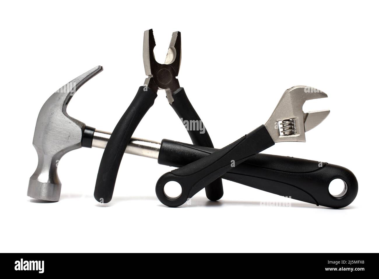 Close up of a claw hammer of a combination pliers and adjustable wrench ...