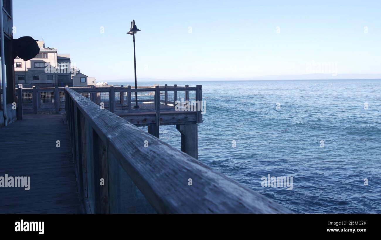 Waterfront wooden boardwalk in Monterey, California USA. Beachfront ...