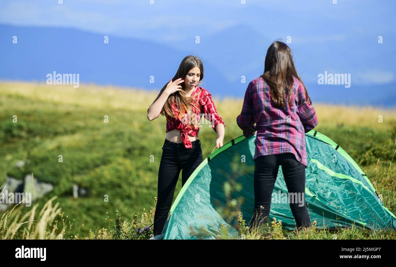 Group friends set up tent on top mountain. Camping hiking. Hiking ...