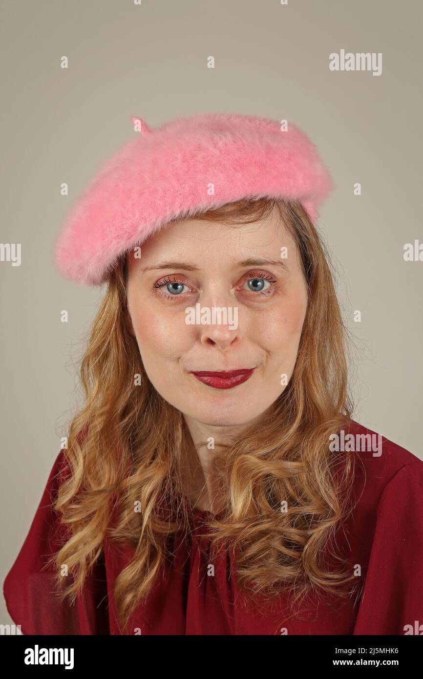 Beautiful blonde hair girl with pink fluffy beret hat Stock Photo - Alamy