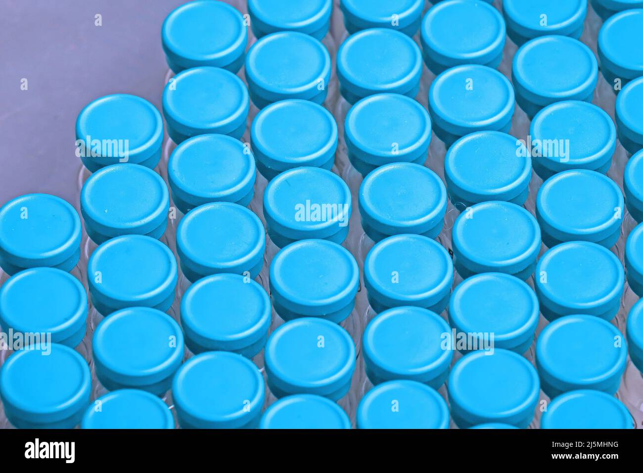 Large closed covid-19 vaccines vials stack inside pharma factory Stock ...