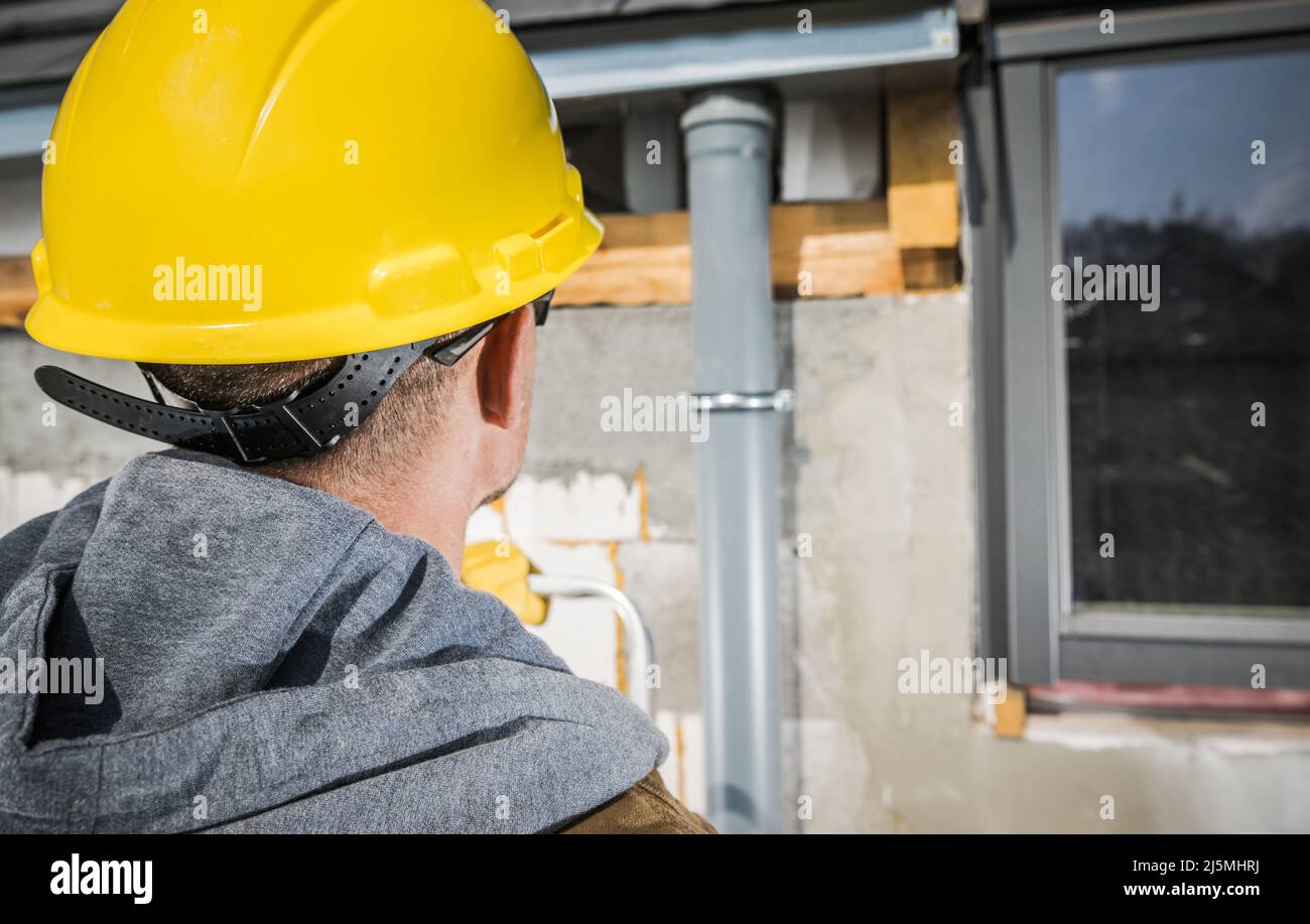Caucasian Construction Contractor Wearing Yellow Hard Hat Staying in ...