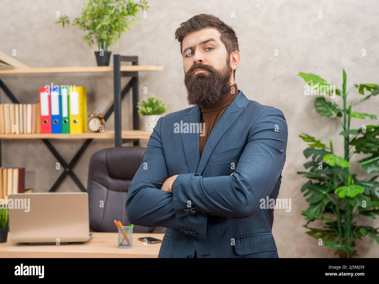confident mature man leader in jacket standing at office, business ...