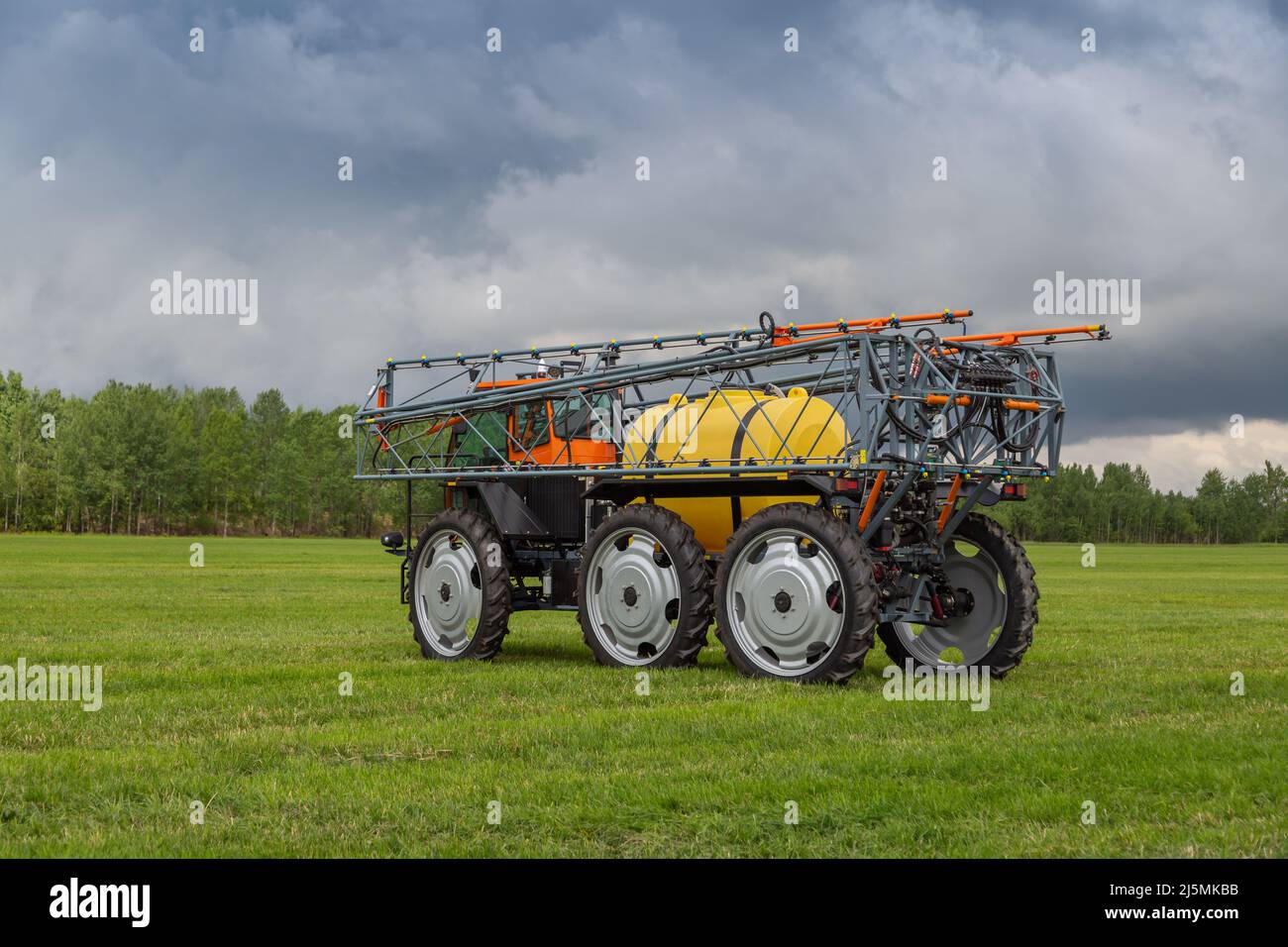 Russia, Leningrad Region - June, 2019: Tractor with equipment for ...