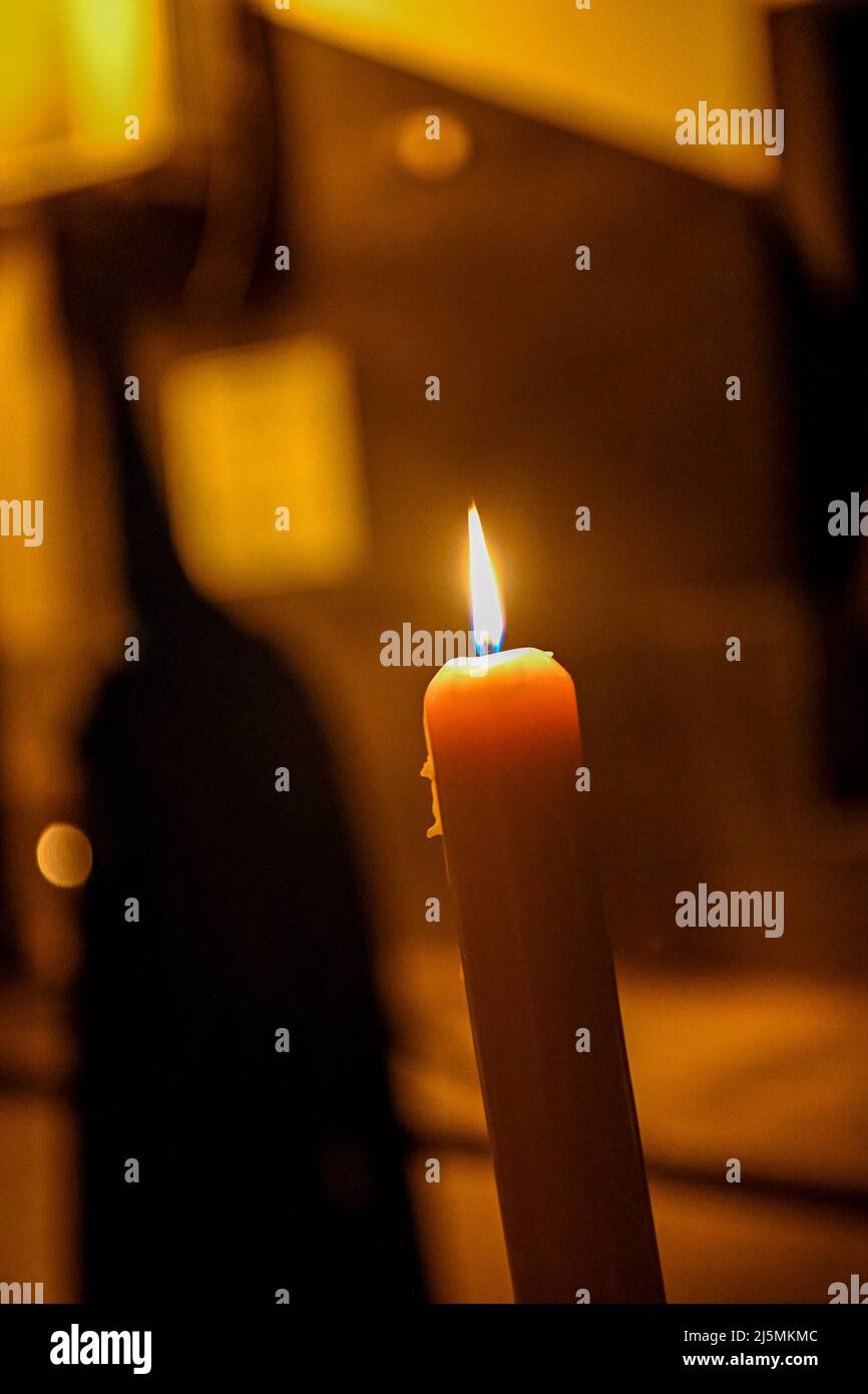 Penitent with a candle, in the procession in Holy Week Stock Photo - Alamy