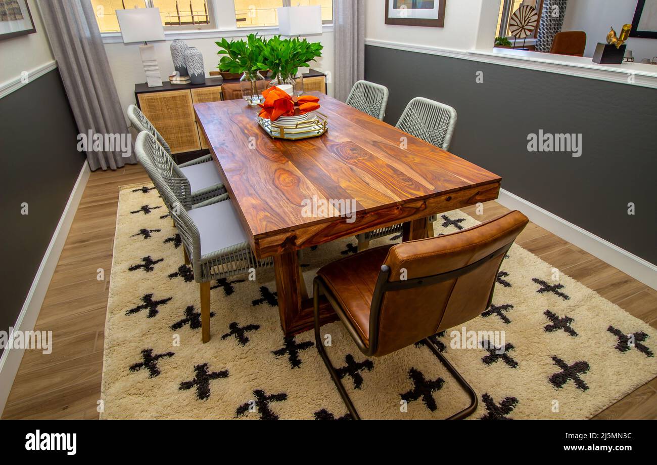 Dining Area With Thick Wooden Table With Six Chairs Stock Photo - Alamy