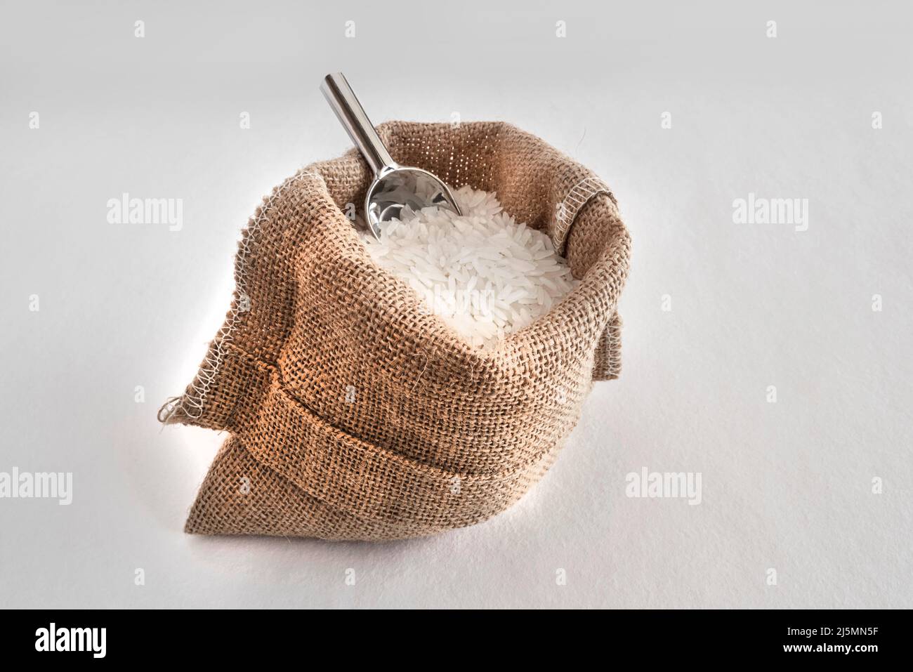 White rice in a hessian bag Stock Photo - Alamy