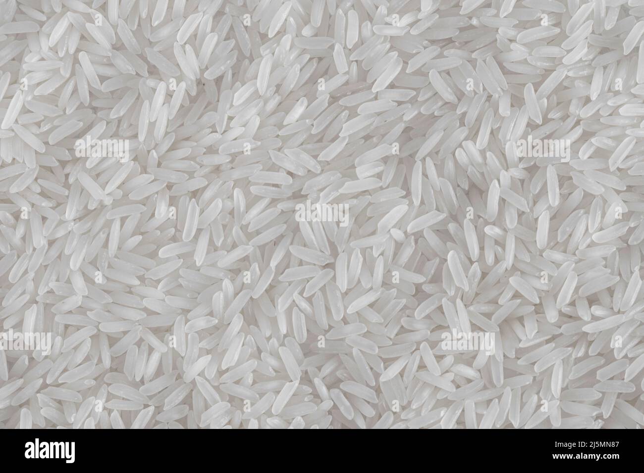 Texture of white rice grains Stock Photo - Alamy