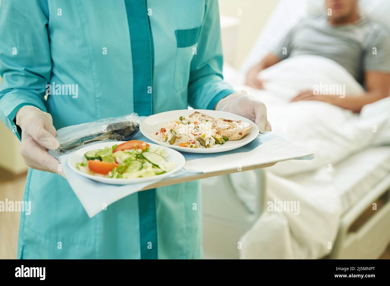 Medical person keeping tray with food in hospital Stock Photo - Alamy