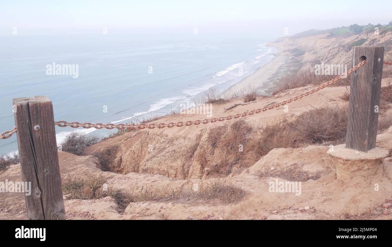 Steep unstable cliff, rock or bluff, foggy weather, California coast ...