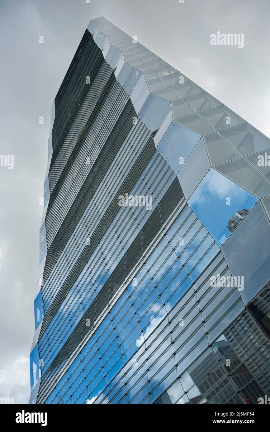 Modern urban architecture: Residential tower block clad in glass with a ...