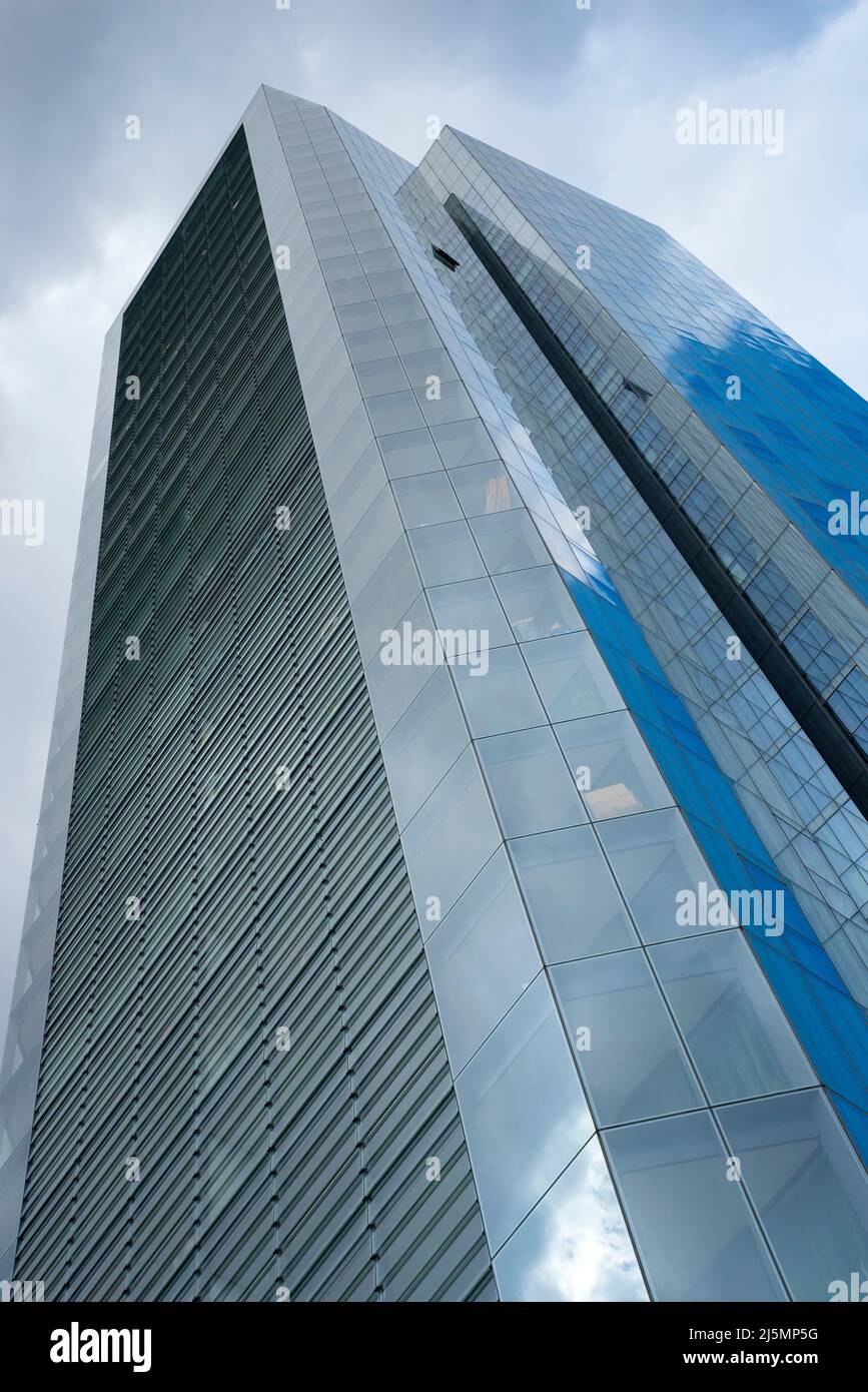 Modern urban architecture: Residential tower block clad in glass with a ...