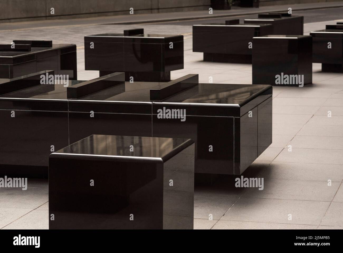 Polished granite seating in a public space in the City of London Stock ...