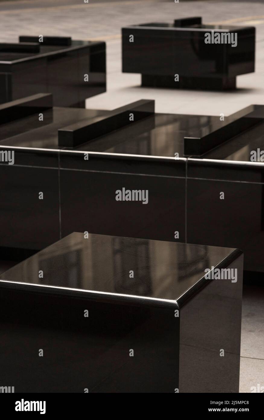 Polished granite seating in a public space in the City of London Stock ...