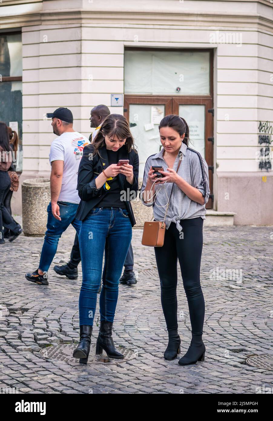 Bucharest, Romania - 04.08.2022: Two girls tourists in the Bucharest ...