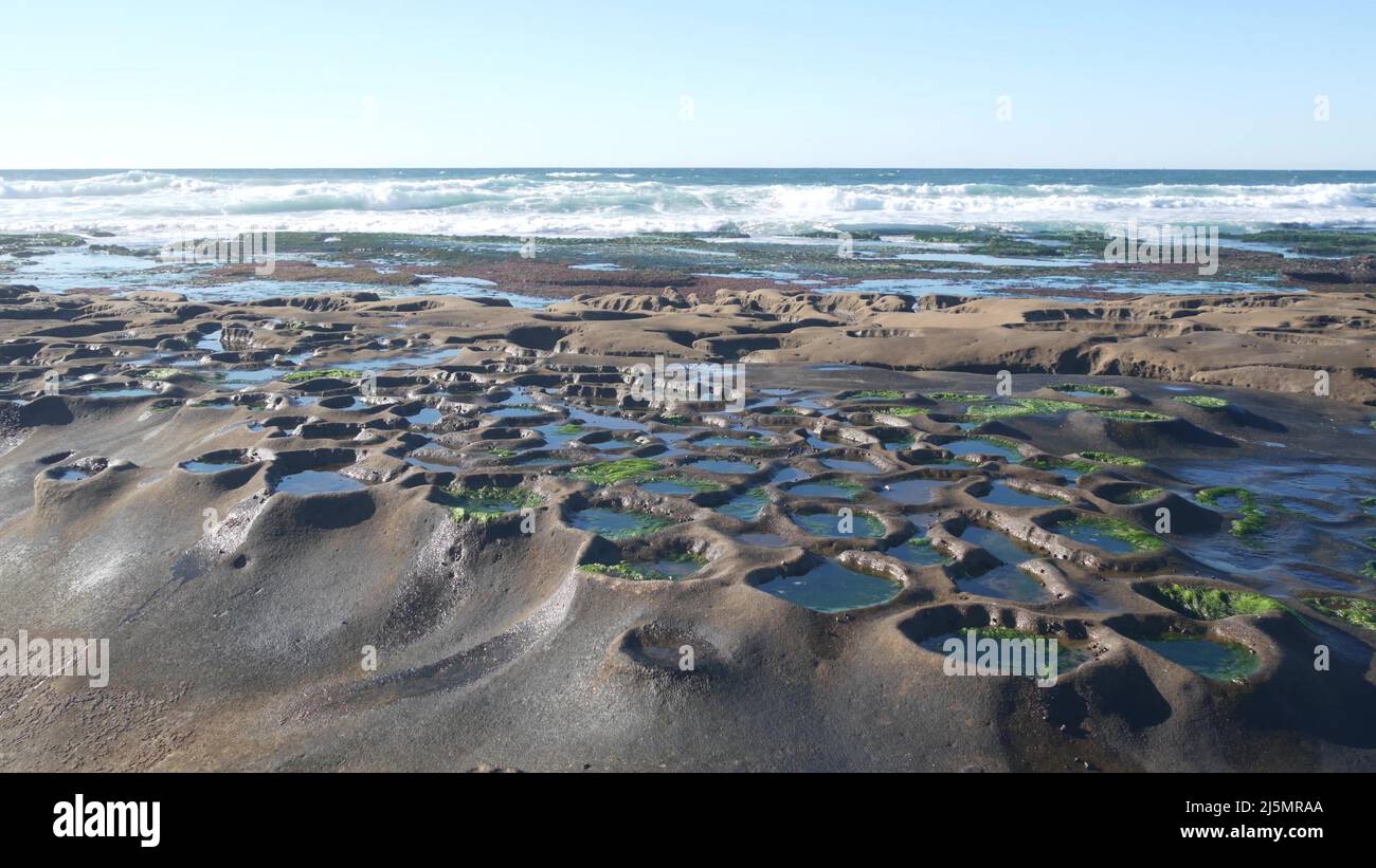Eroded rock formation, tide pool in La Jolla, California coast, USA ...