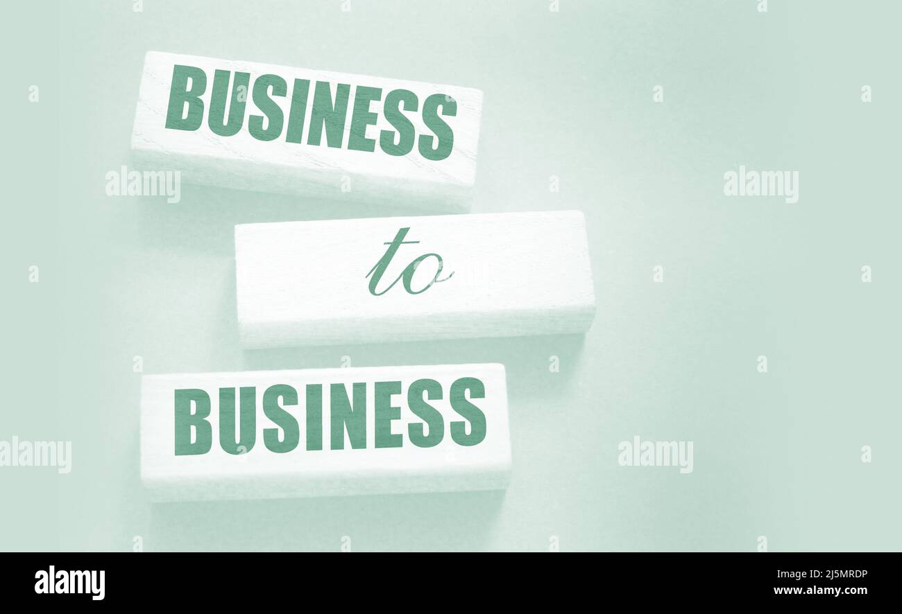 Wooden blocks with words Business to Business. B2B marketing concept ...