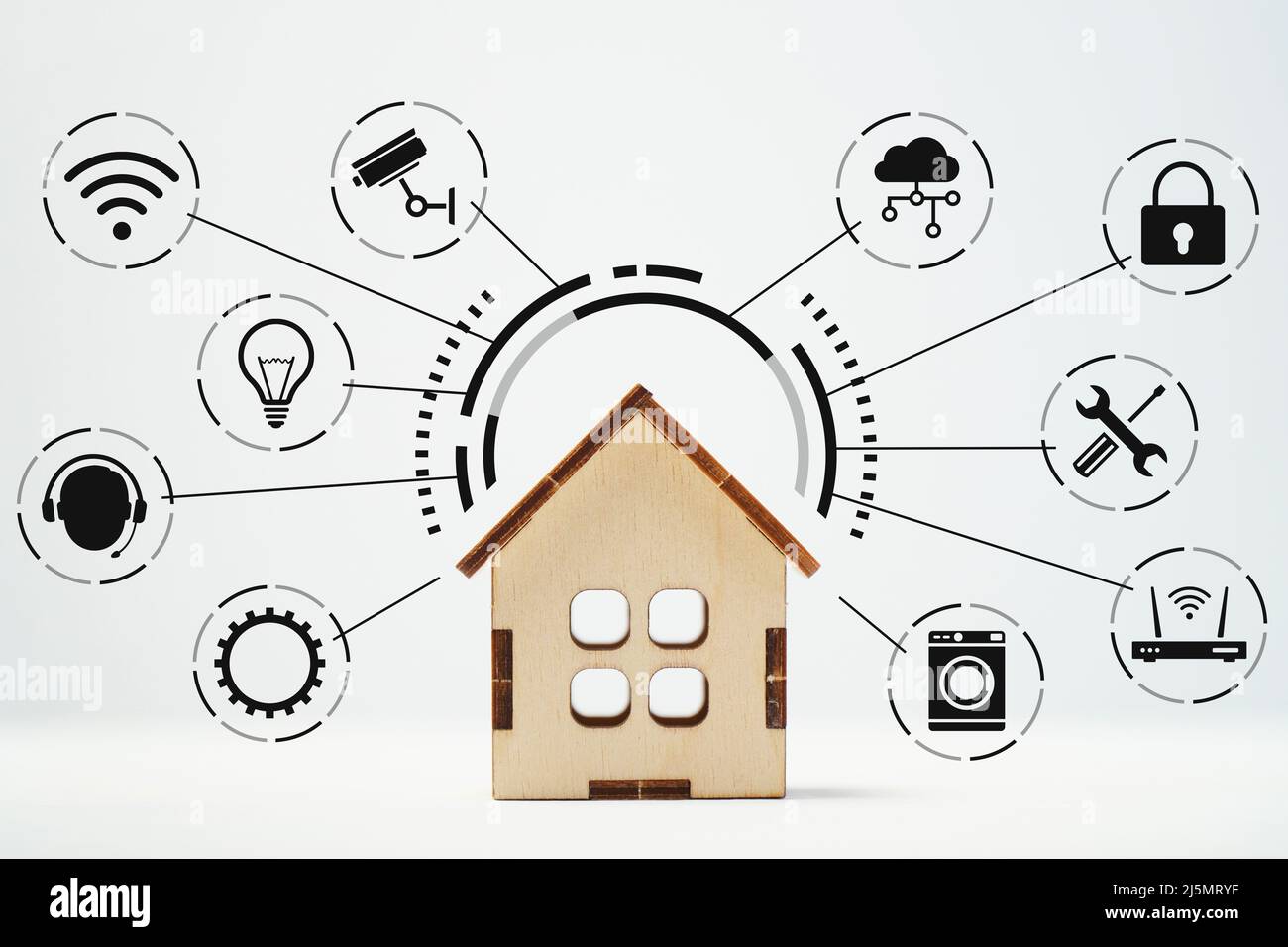 IOT or Internet of Things and smart home. Icons around the house model ...