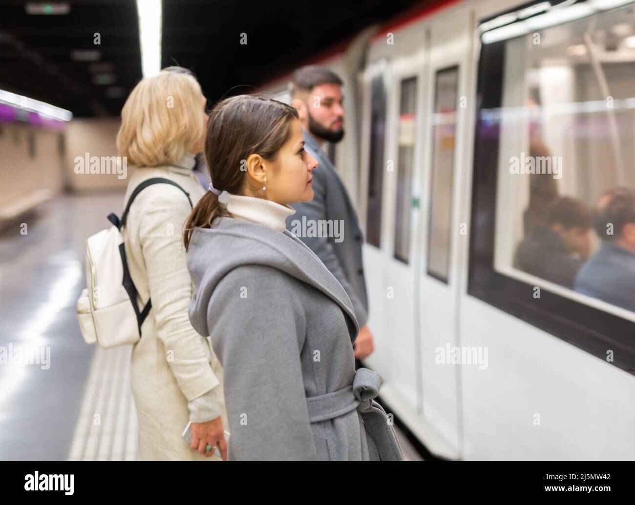 Passengers enter subway cars Stock Photo - Alamy