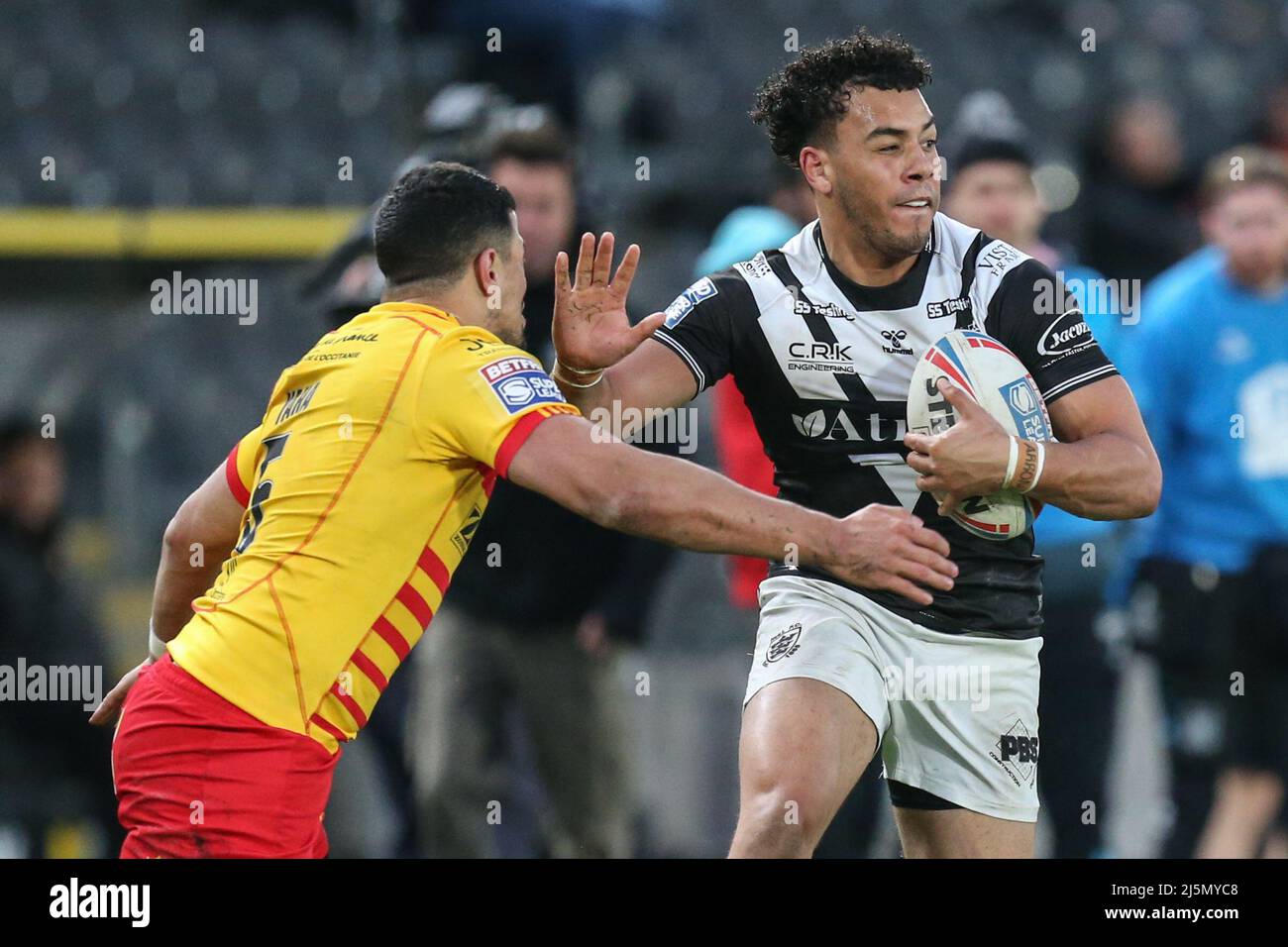 Darnell McIntosh #5 of Hull FC looks to go past Fouad Yaha #5 of Catalans Dragons Stock Photo ...