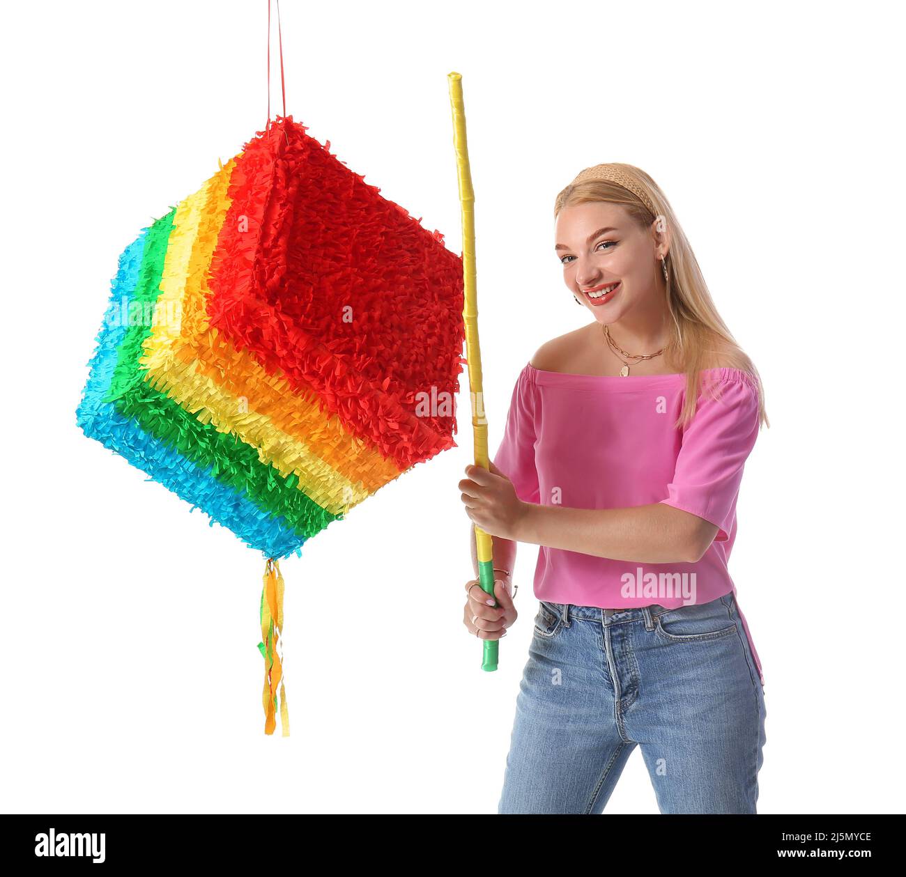 Happy young woman breaking Mexican pinata on white background Stock ...