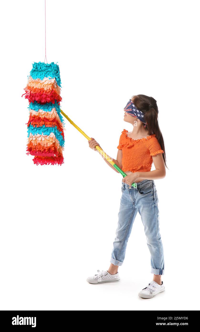 Little girl breaking Mexican pinata on white background Stock Photo - Alamy