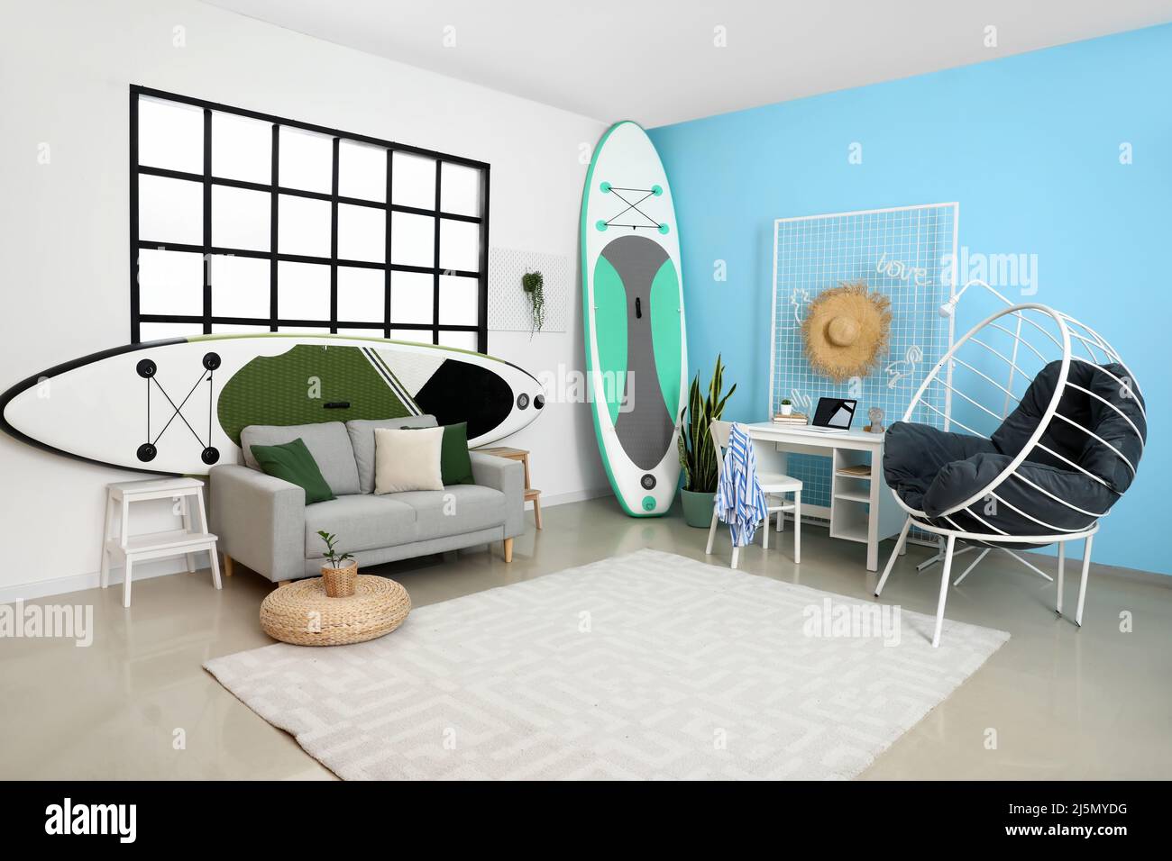 Interior of modern room with comfortable workplace and board for sup ...