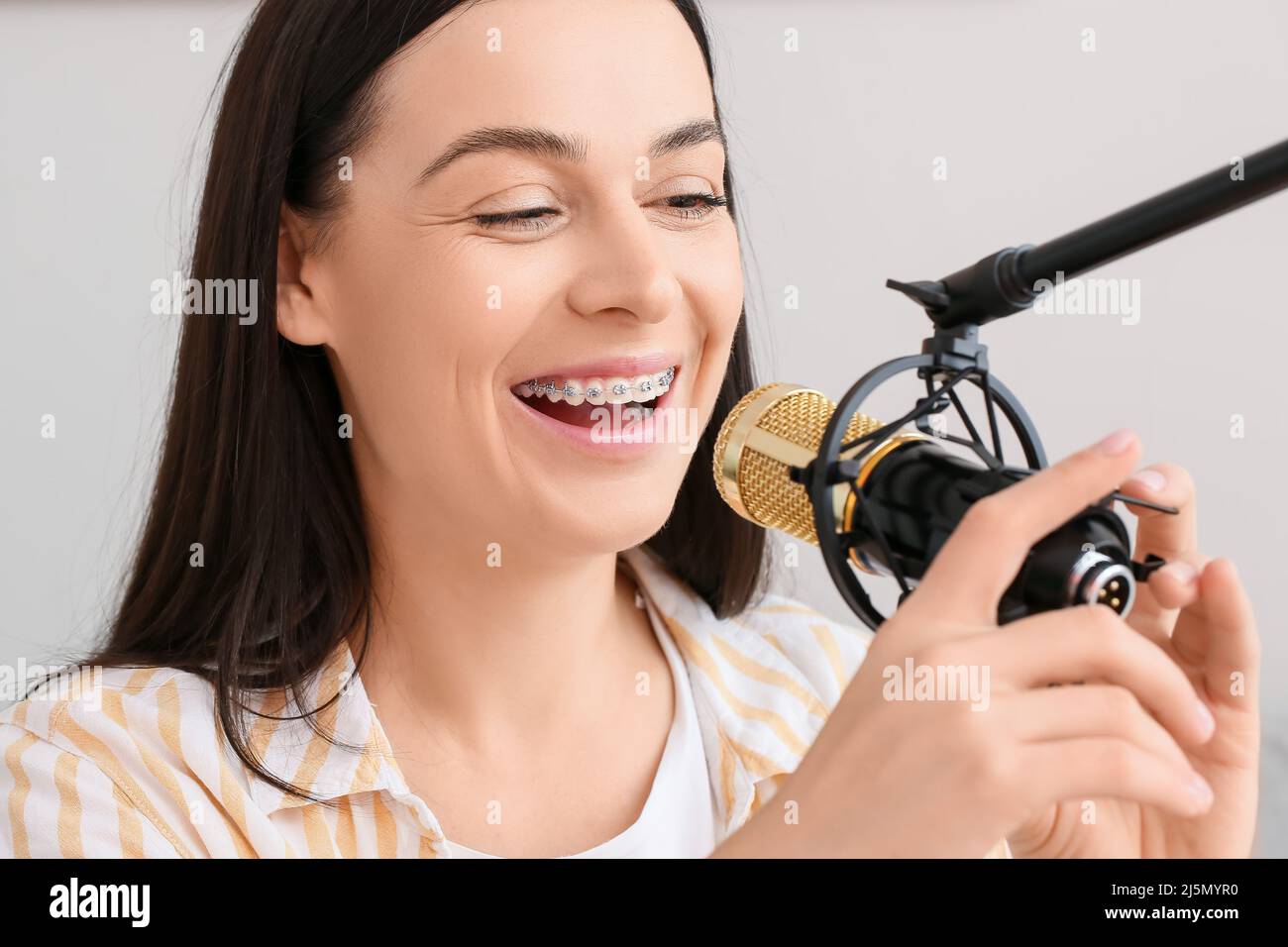 Female singer using radio microphone hi-res stock photography and ...