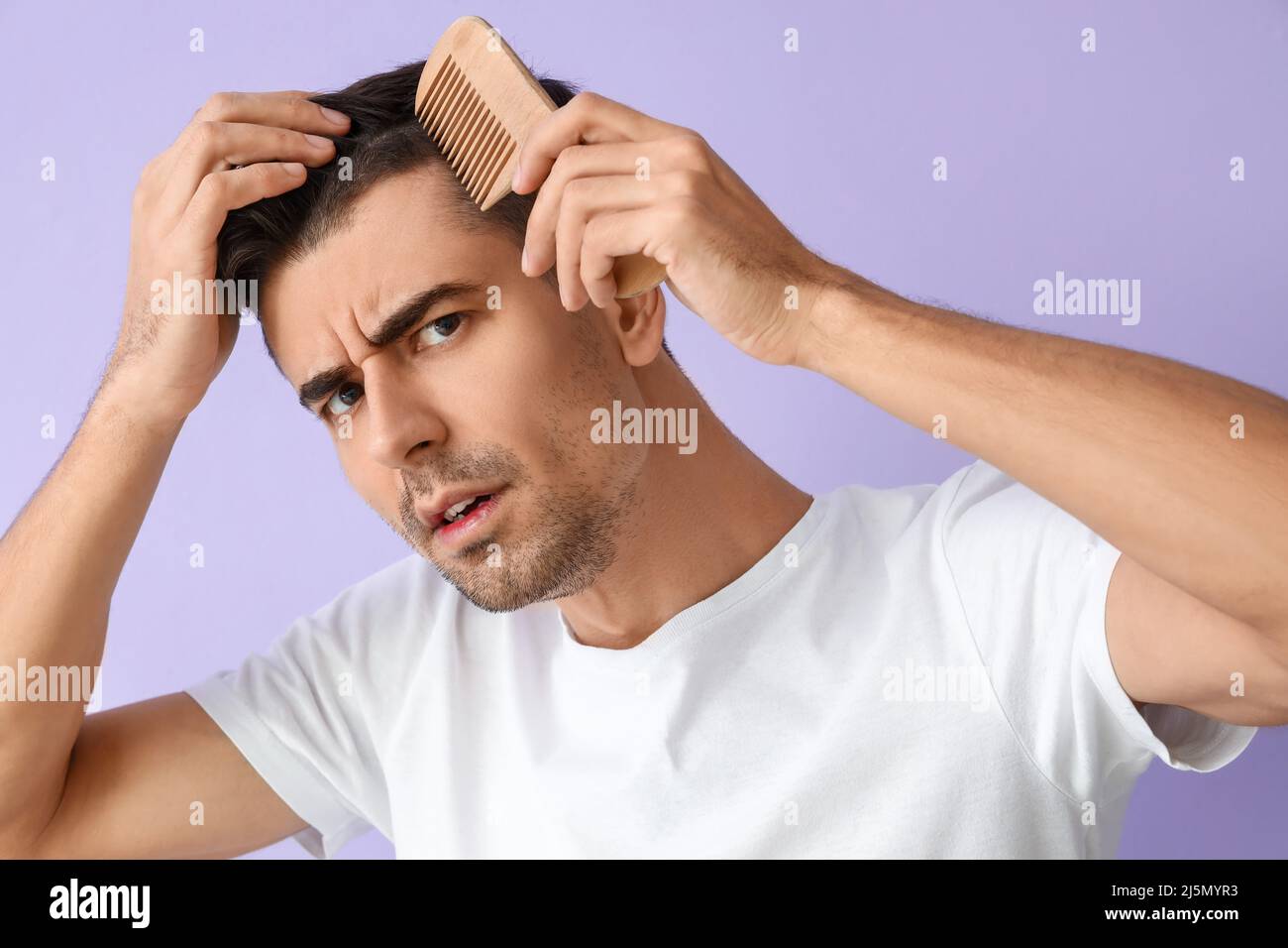Man combing thinning hair hi-res stock photography and images - Alamy