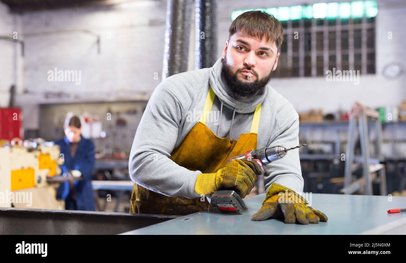 Sheet metal worker drilling hi-res stock photography and images - Alamy