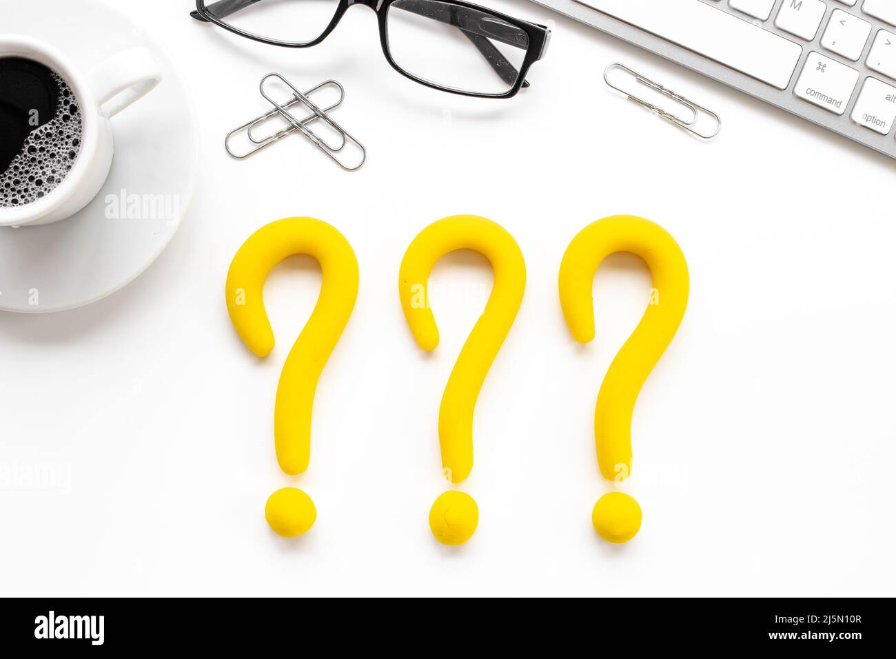 Question mark symbol on office desk. Solving problem or search solution ...