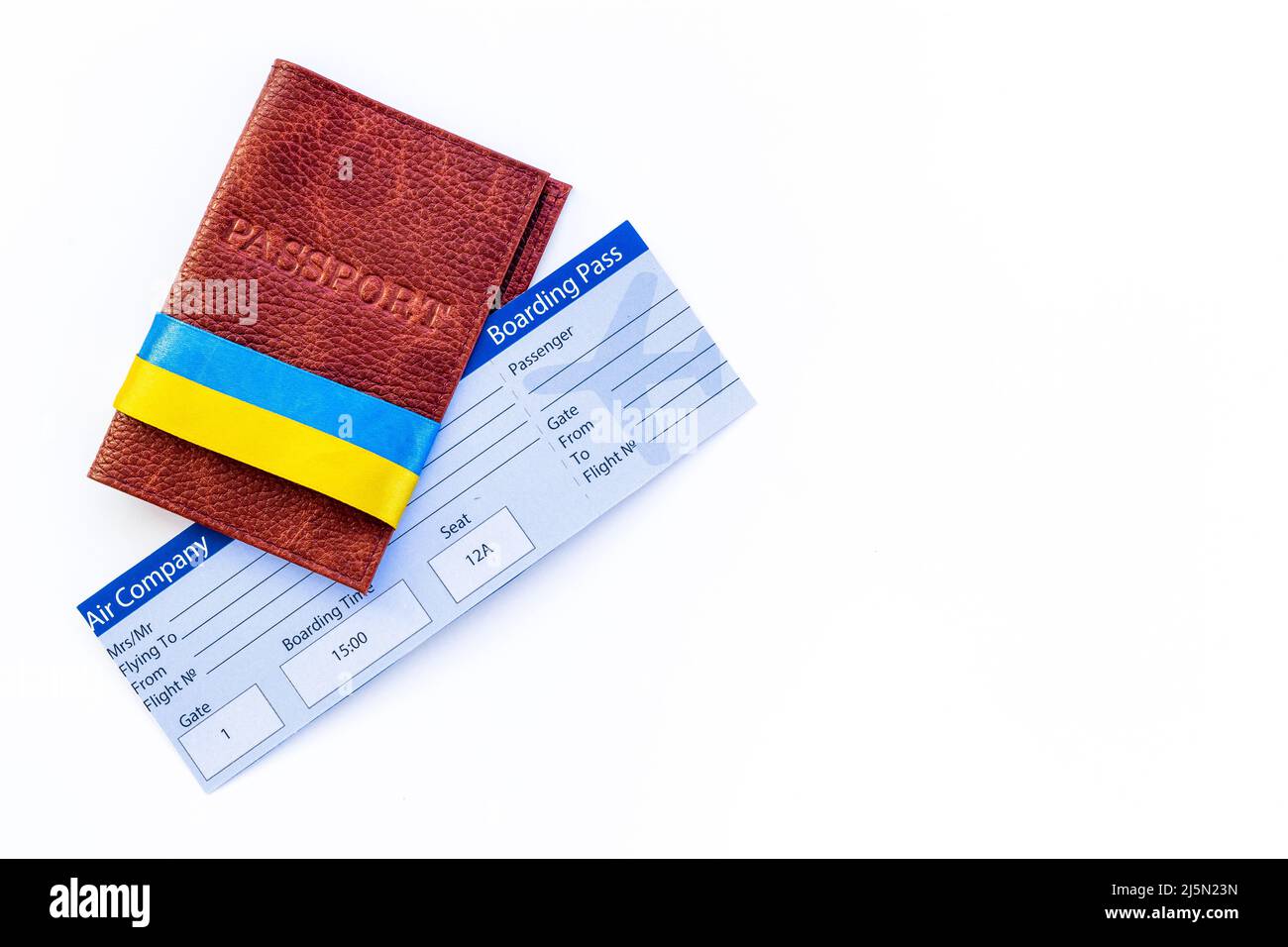 Ukrainian immigration concept - yellow and blue ribbon on passport ...