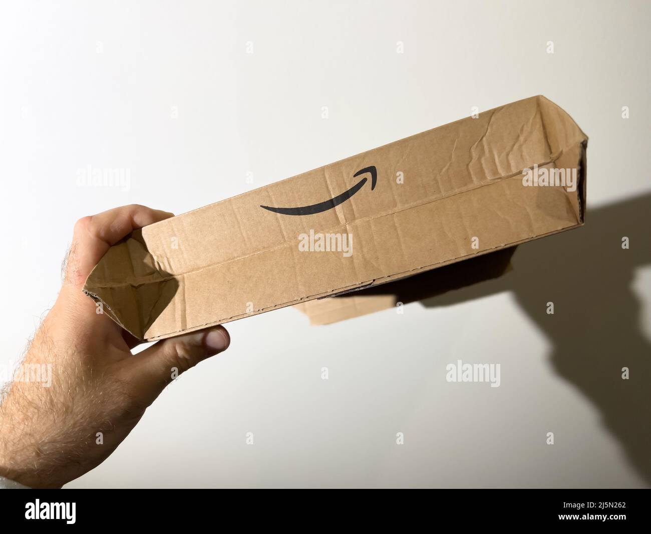 Paris, France - Apr 24, 2022: POV male hand holding against wall hero ...