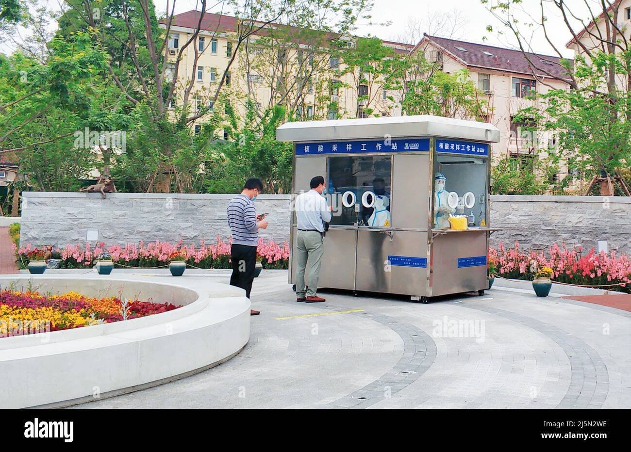 SHANGHAI, CHINA - APRIL 24, 2022 - Couriers and volunteers take nucleic ...