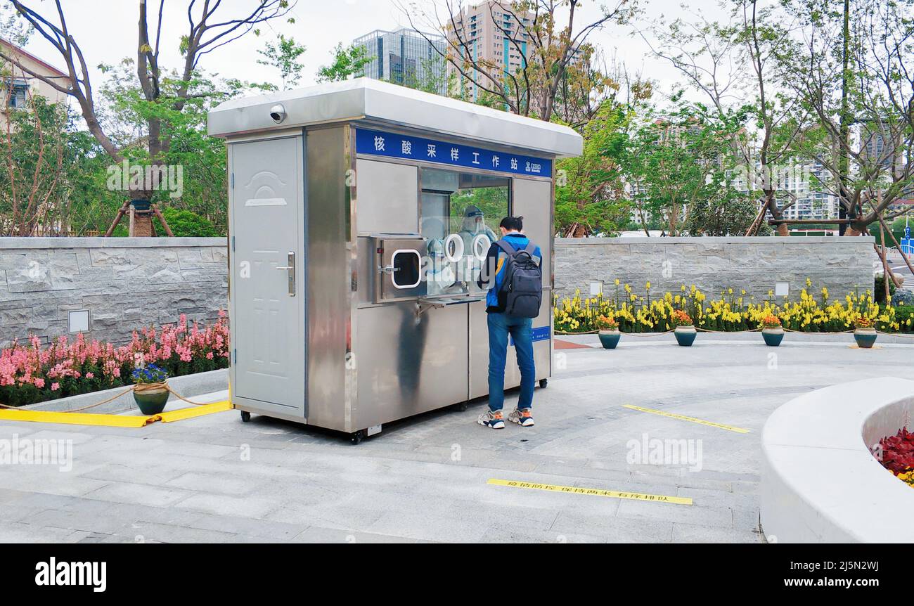 SHANGHAI, CHINA - APRIL 24, 2022 - Couriers and volunteers take nucleic ...