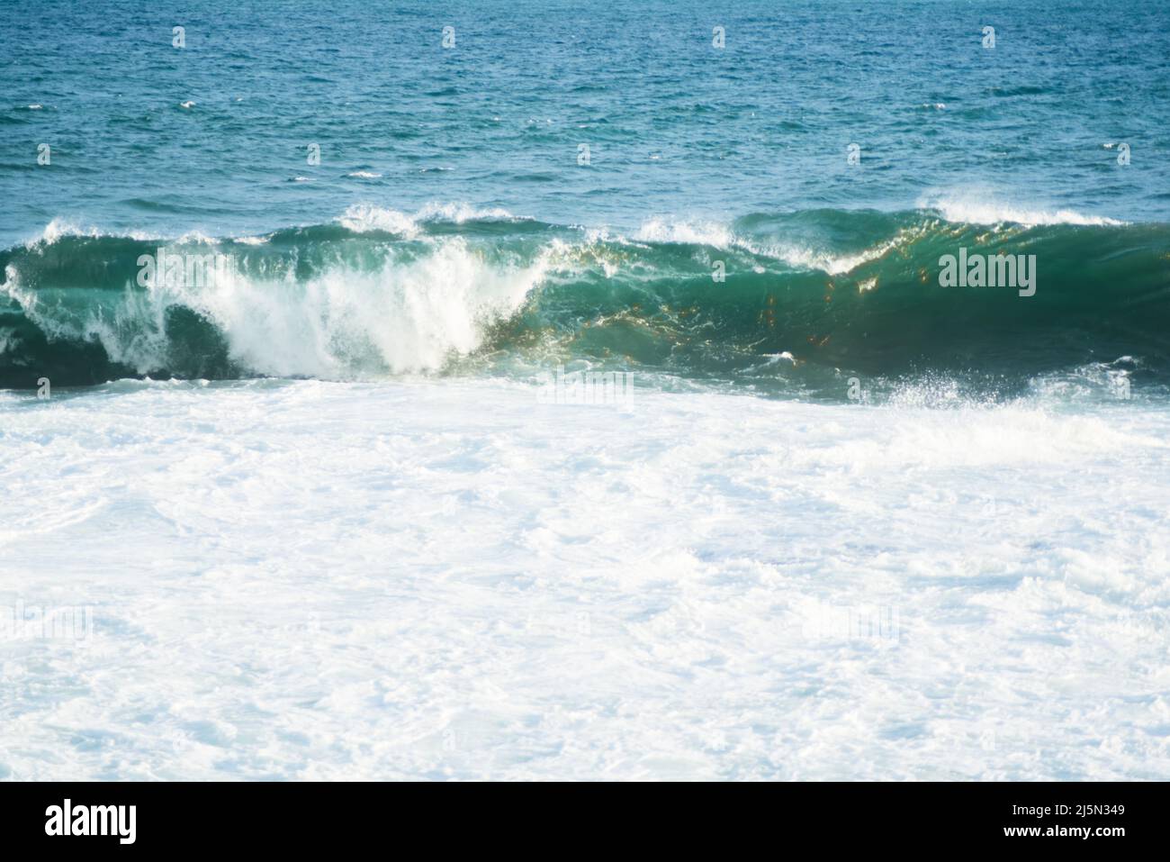 Medium waves crashing on the beach. Salvador city, Bahia state, Brazil ...