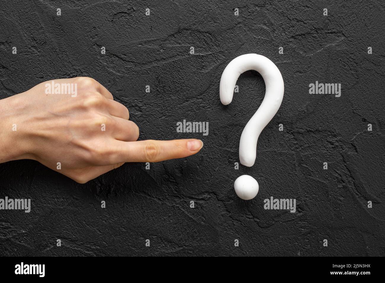 Hand with question mark symbol. FAQ and help concept Stock Photo - Alamy