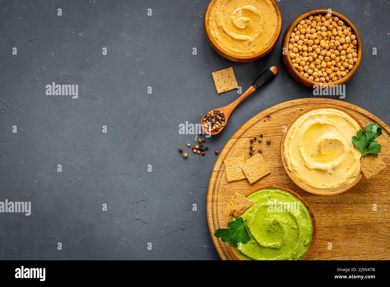 Hummus with snacks set - various types of hummus in bowls Stock Photo ...