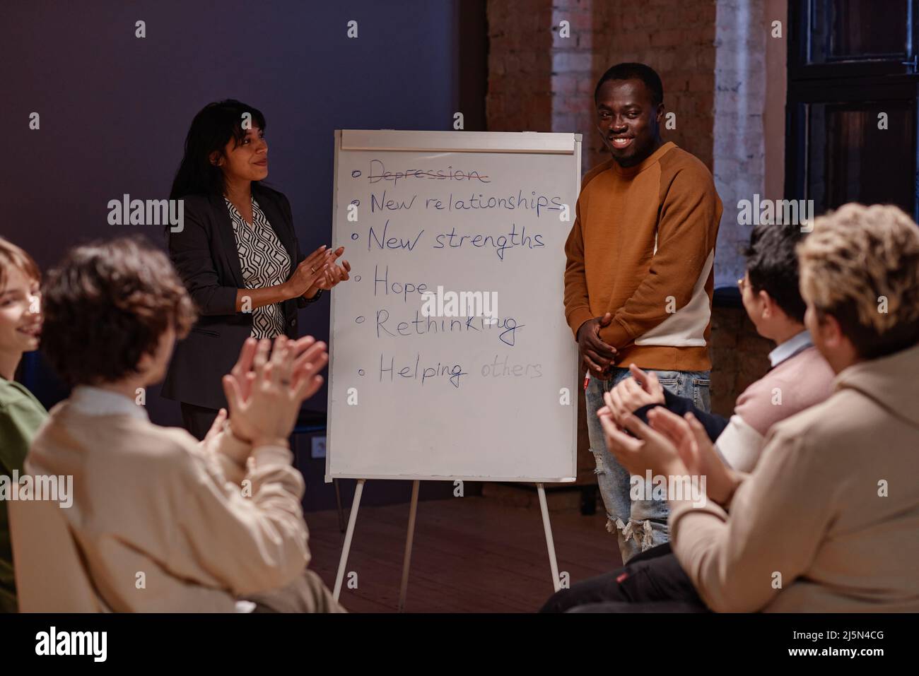 Horizontal shot of people clapping hands to joyful Black man ...