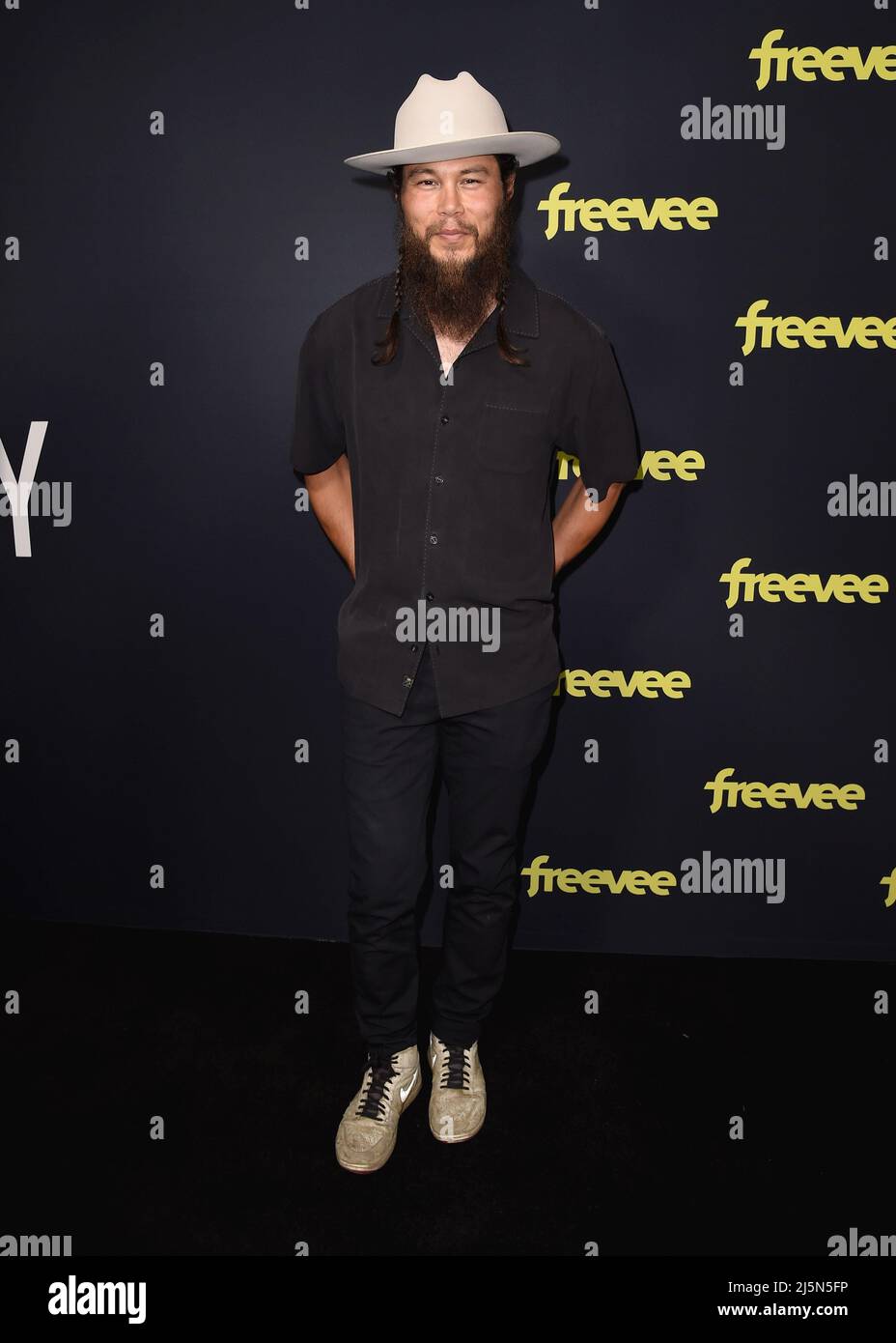 Stephen A. Chang walking on the red carpet at the Los Angeles premiere ...