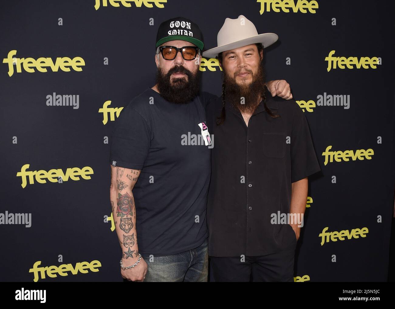 Titus Welliver and Stephen A. Chang walking on the red carpet at the Los Angeles premiere of ...