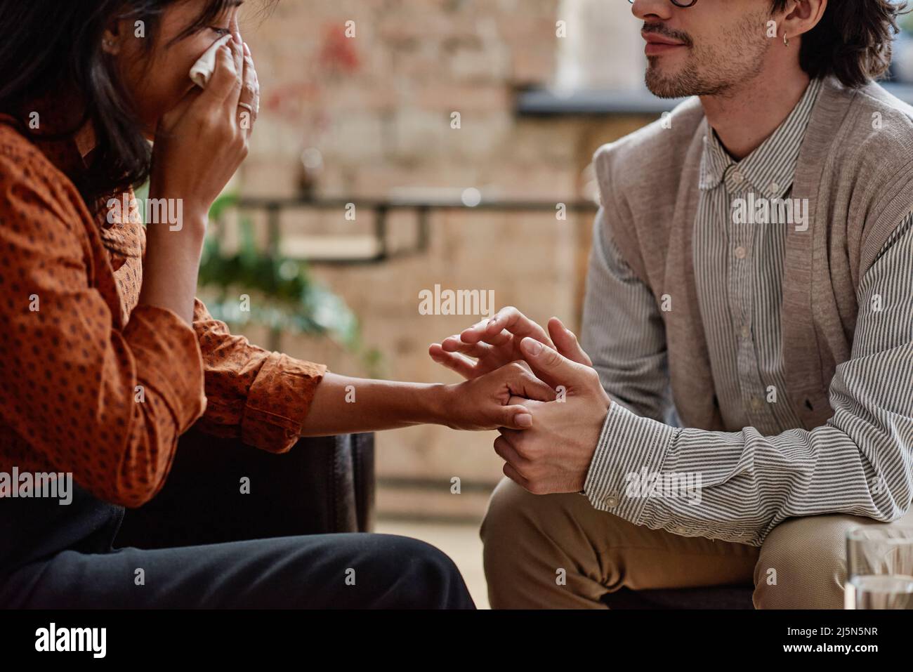 Horizontal shot of young man working as professional psychologist ...