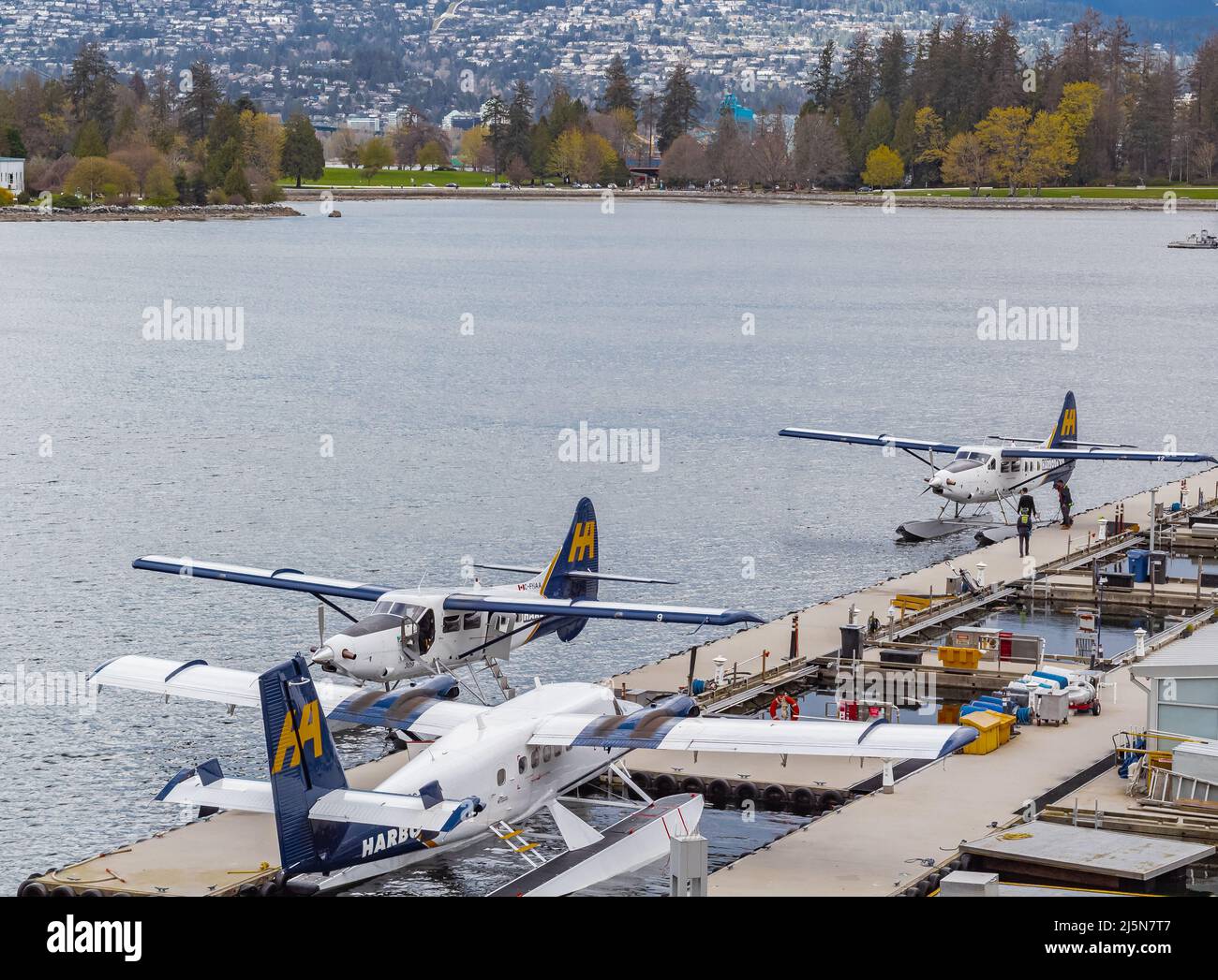 Float planes docked at Vancouver's Harbour Airport in overcast day. Air ...