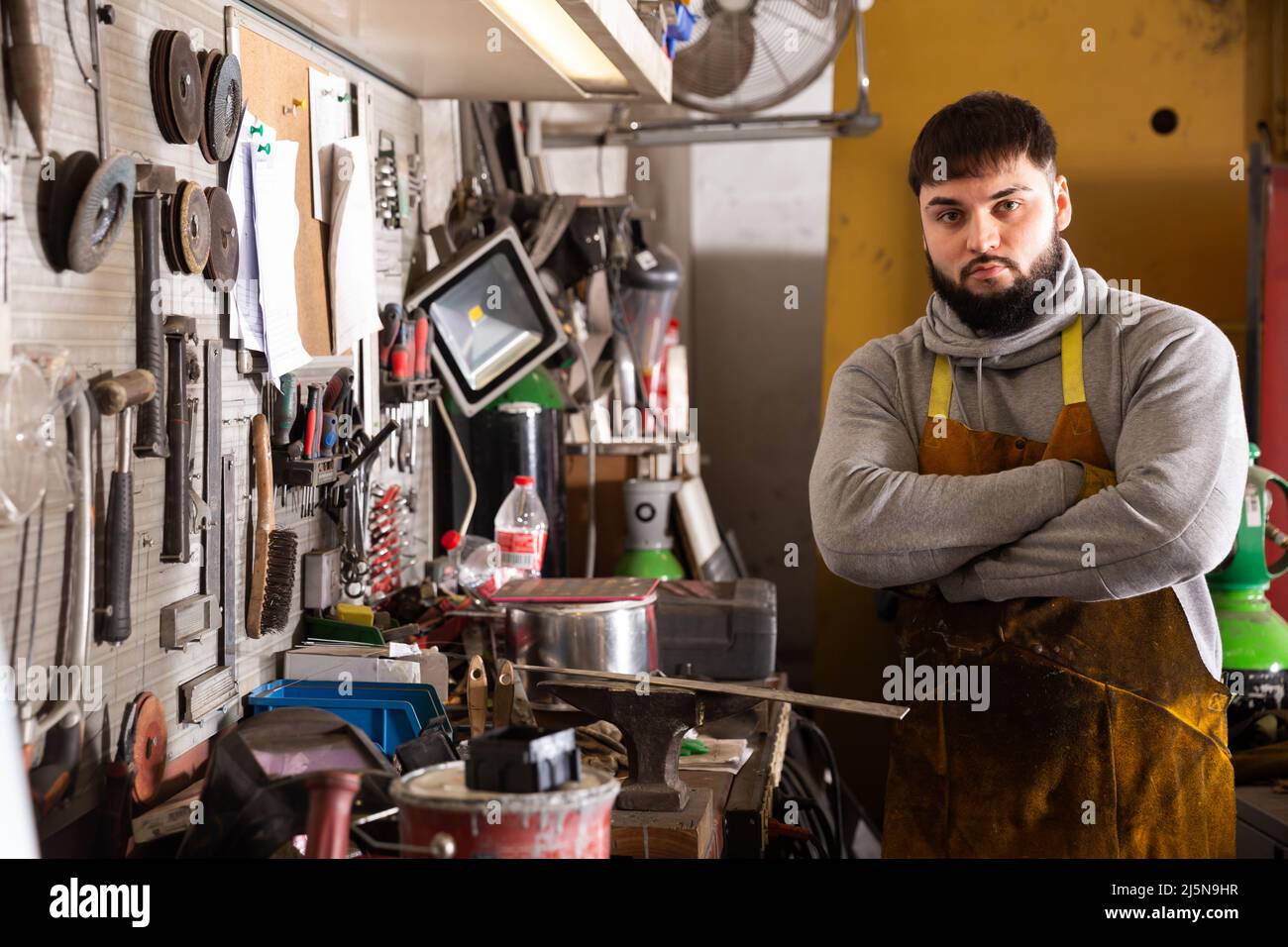 Professional man worker during work with steel in workshop Stock Photo ...