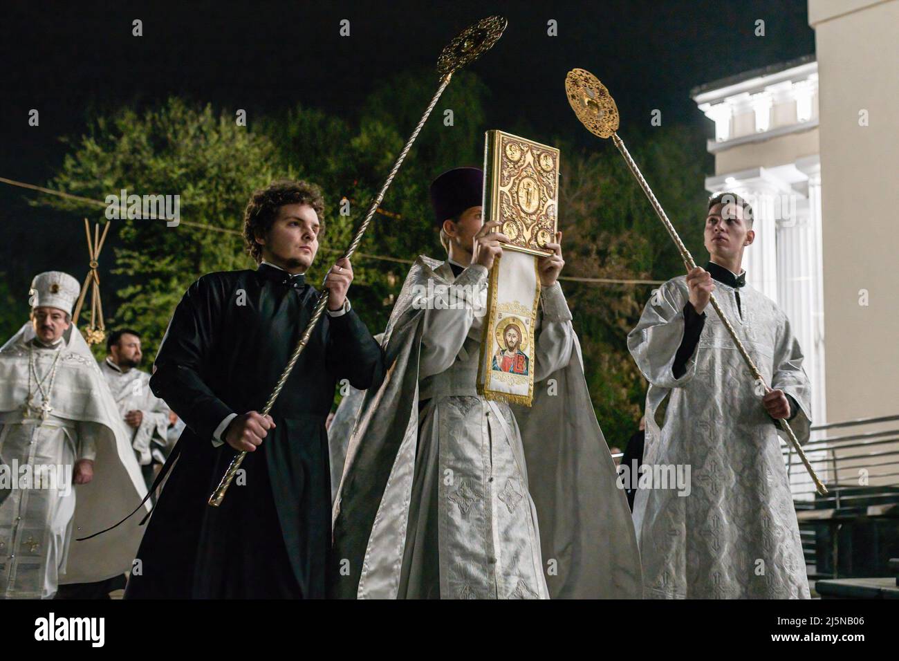 Priests and deacons carry religious images of Christ during the Easter ...
